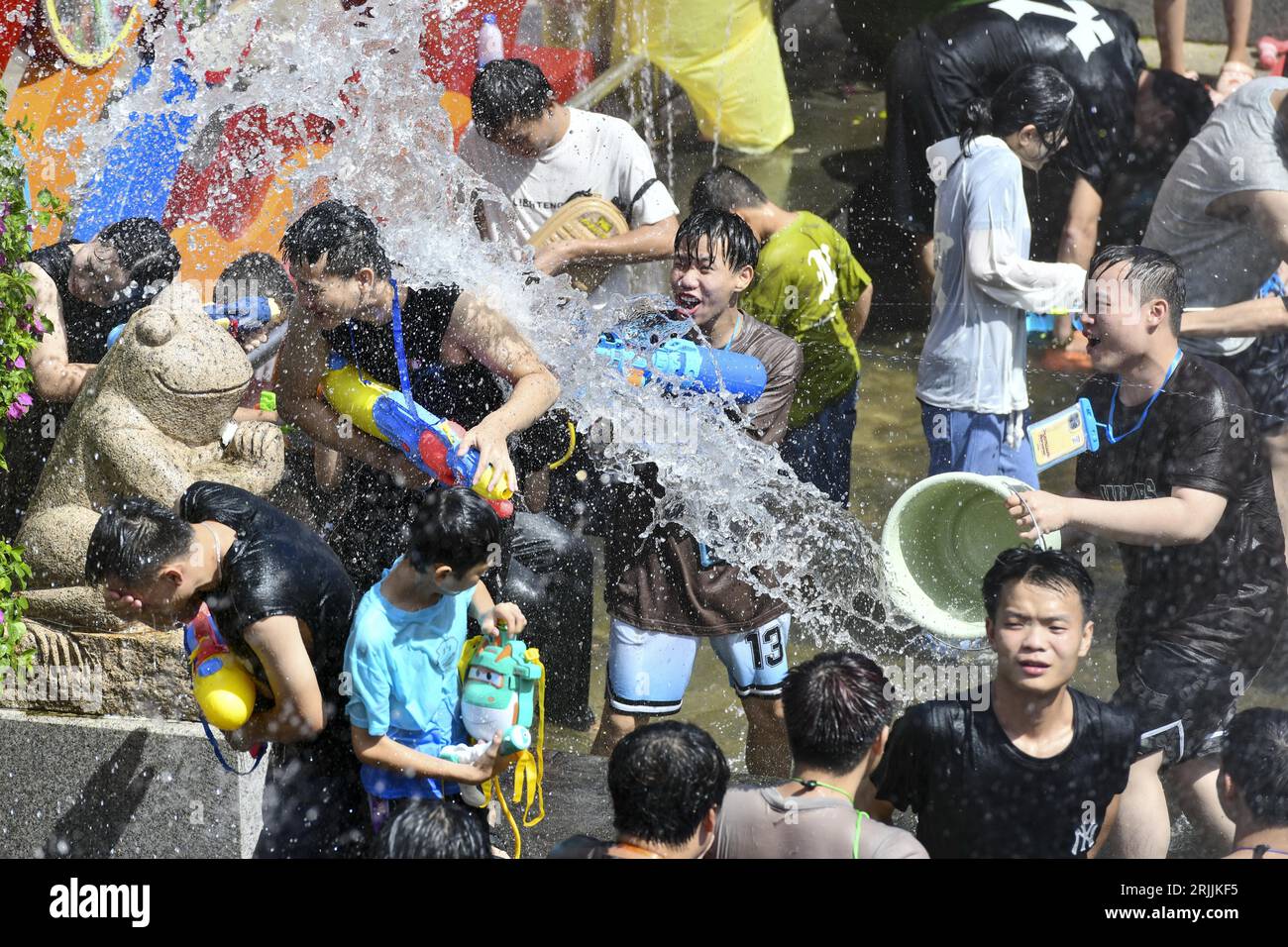 **CHINESE MAINLAND, HONG KONG, MACAU AND TAIWAN OUT** People splash hot ...
