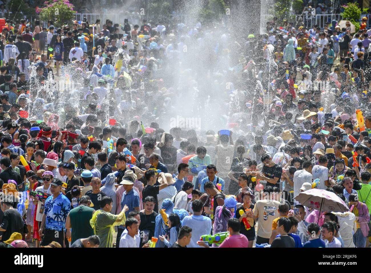 **CHINESE MAINLAND, HONG KONG, MACAU AND TAIWAN OUT** People splash hot ...