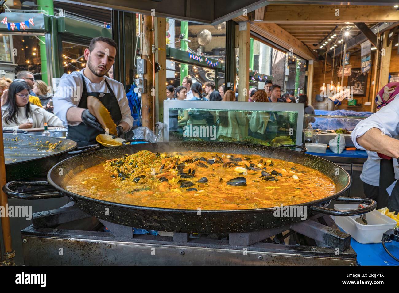 Fresh paella at the Borough Market in London Stock Photo - Alamy