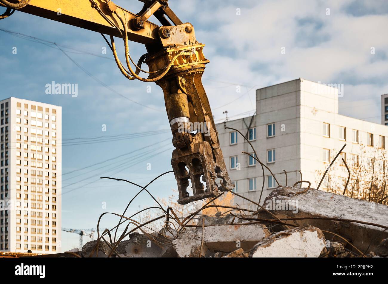 Hydraulic concrete crusher breaks and crushes reinforced concrete Stock ...