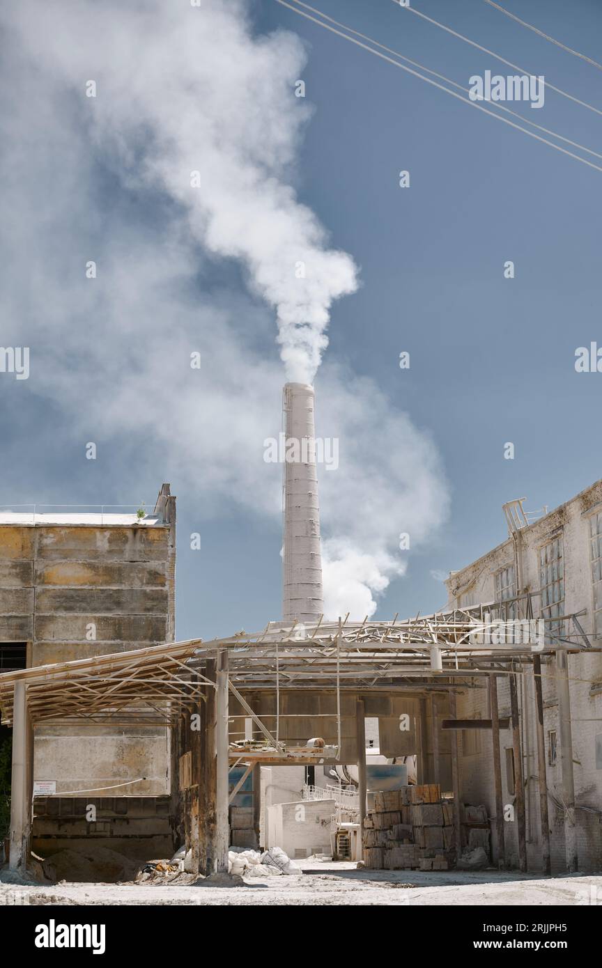 Factory buildings smoking chimney hi-res stock photography and images ...