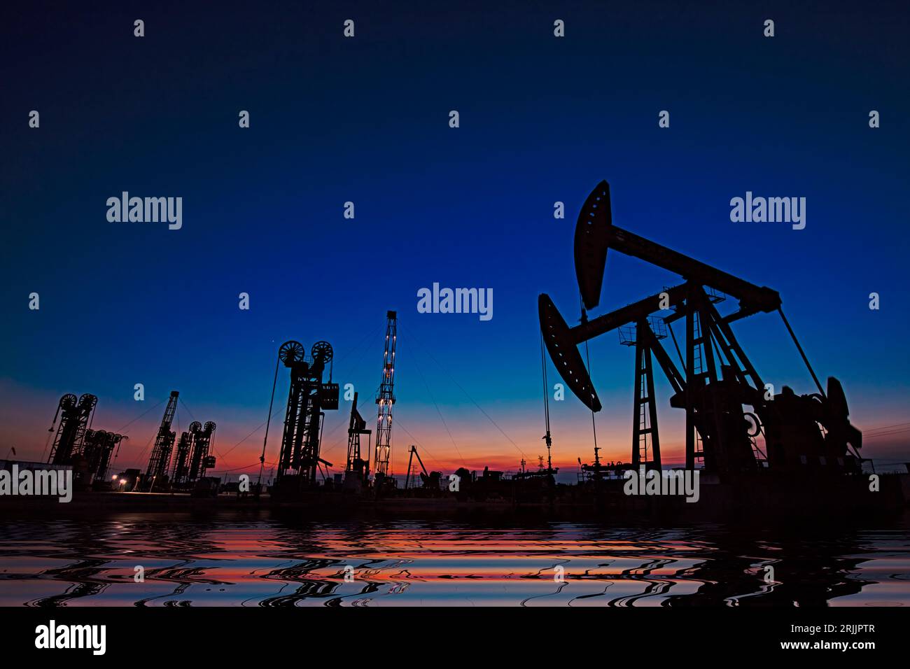 Oil pumping machinery in operation, crude oil extraction scene in the ...