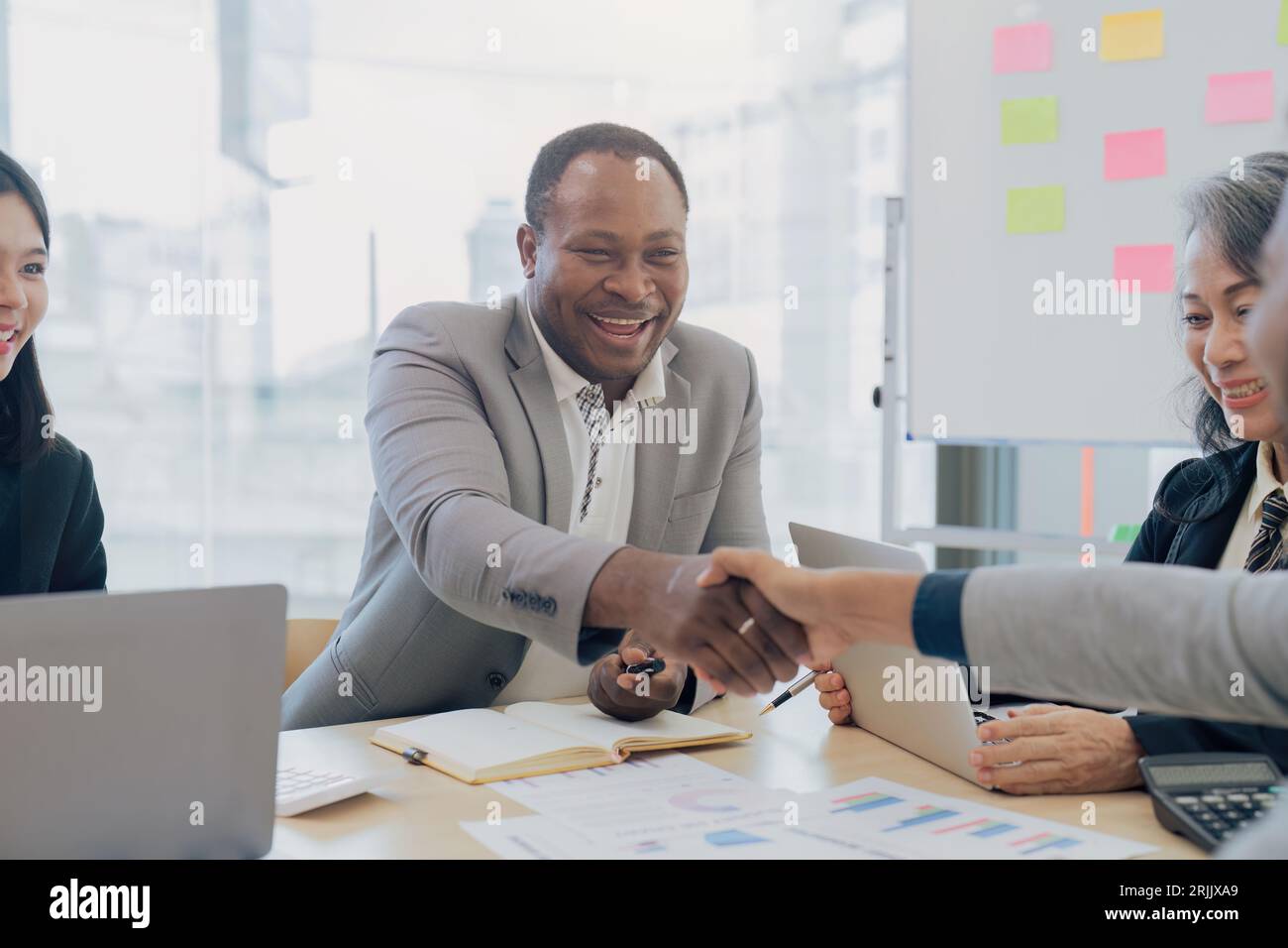 Happy mature business man handshaking corporate client, making ...