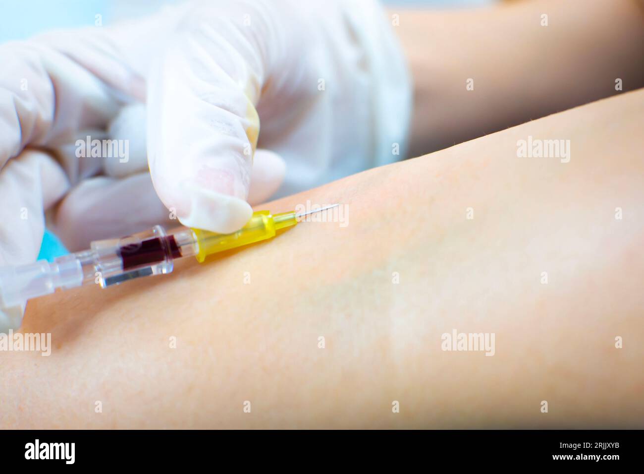 Closeup of a nurse hand administering a medicine to a patient ...
