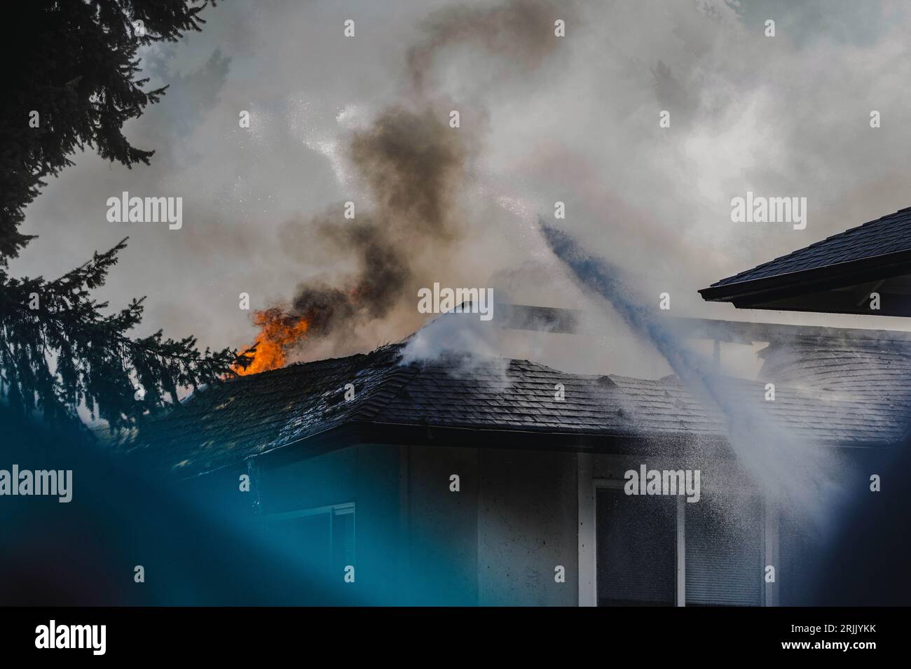 Thick smoke shrouds the area as the massive fire rages through the ...
