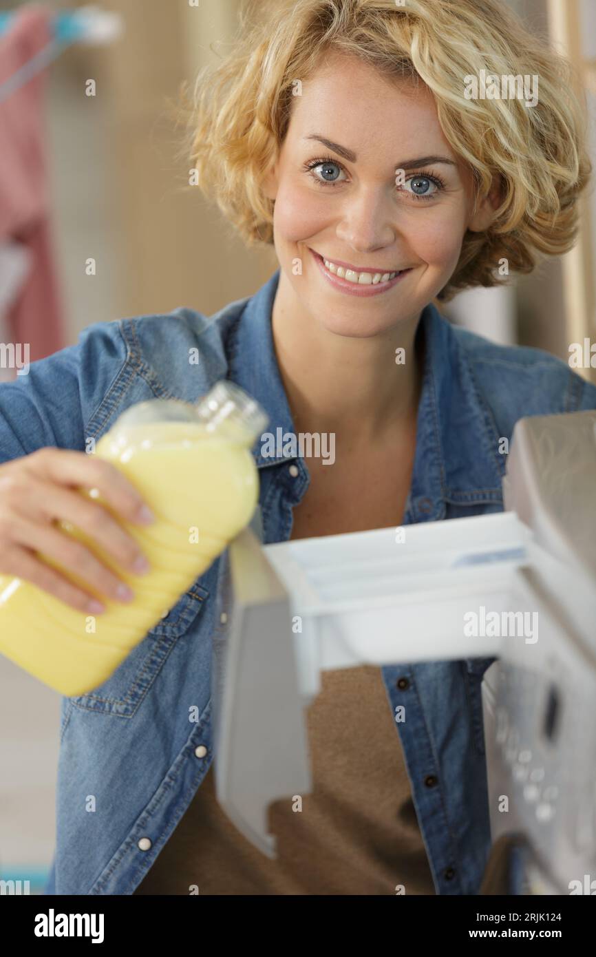 Woman pouring washing detergent in hi-res stock photography and images - Alamy