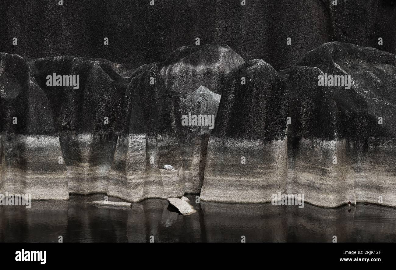 Black granite rock texture. Giant Union Rock monolith at La Digue ...