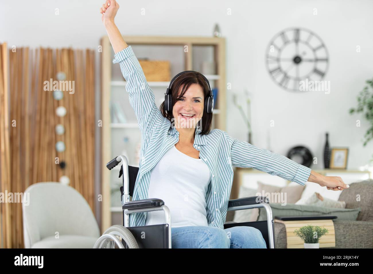 excited young disabled woman opening her arms Stock Photo - Alamy