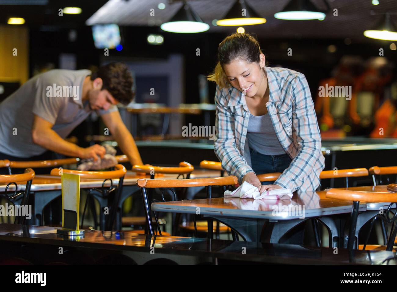 friendly waiters taking cleaning the tables Stock Photo - Alamy