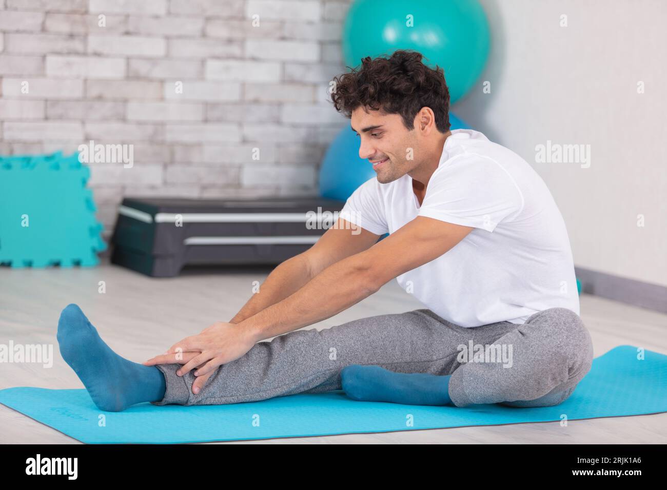 Back stretch exercise man home hi-res stock photography and images - Alamy