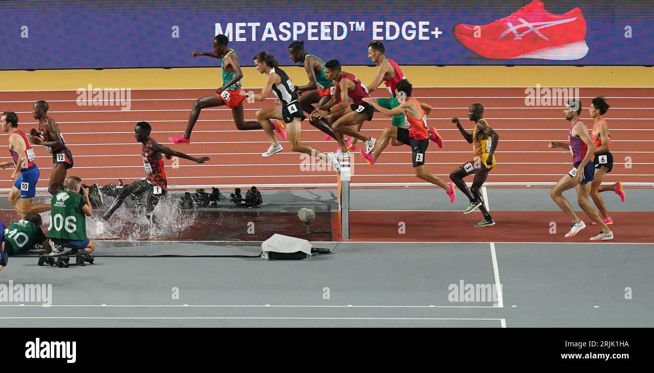 Athletes steeplechase water jump hi-res stock photography and images ...
