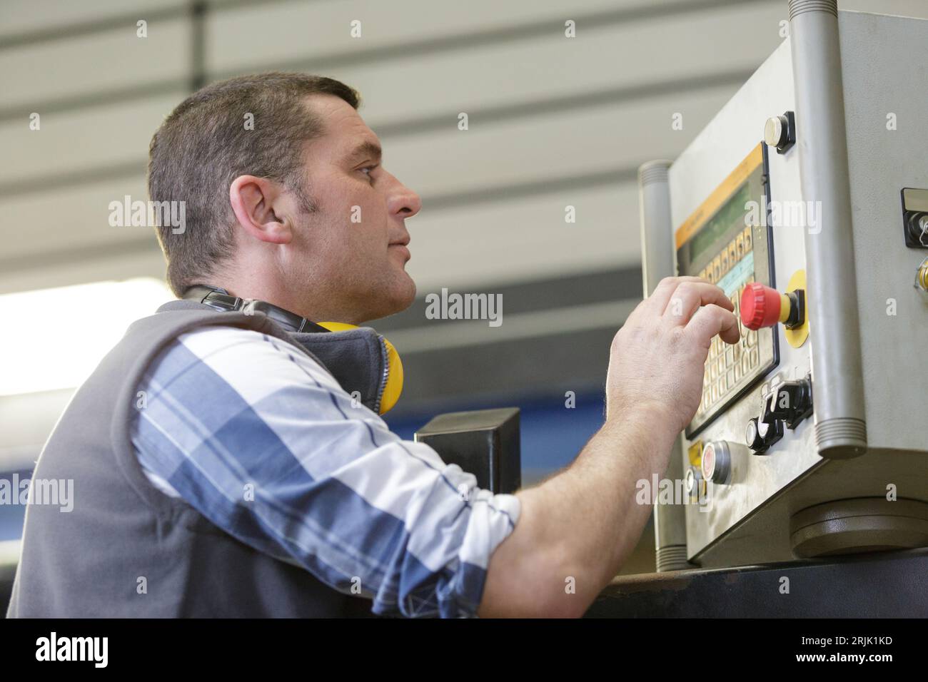 Old warehouse machine man hi-res stock photography and images - Alamy
