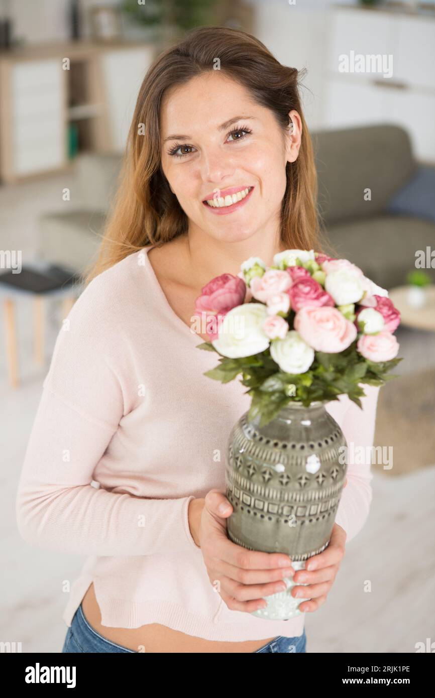 Woman holding a vase hi-res stock photography and images - Alamy