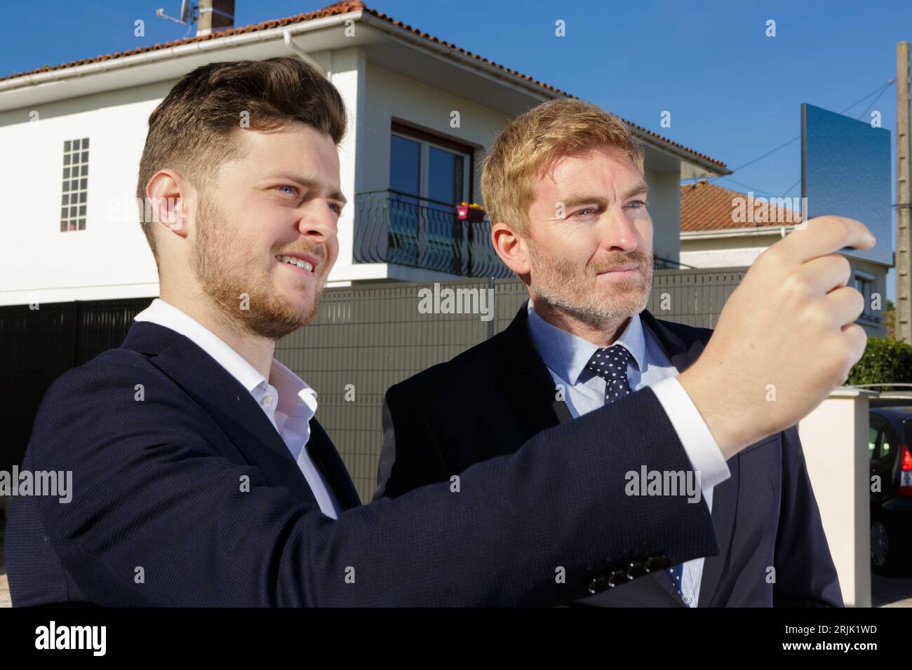 businessmen holding color swatches outdoors Stock Photo - Alamy