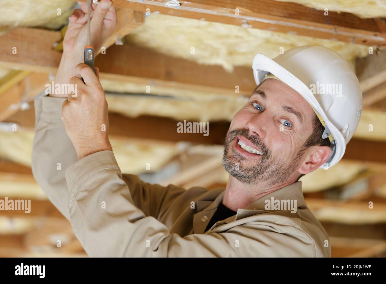 a construction workers building house Stock Photo - Alamy