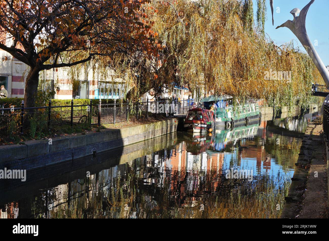 The river Witham with a barge moored on the riverside and Empowerment ...