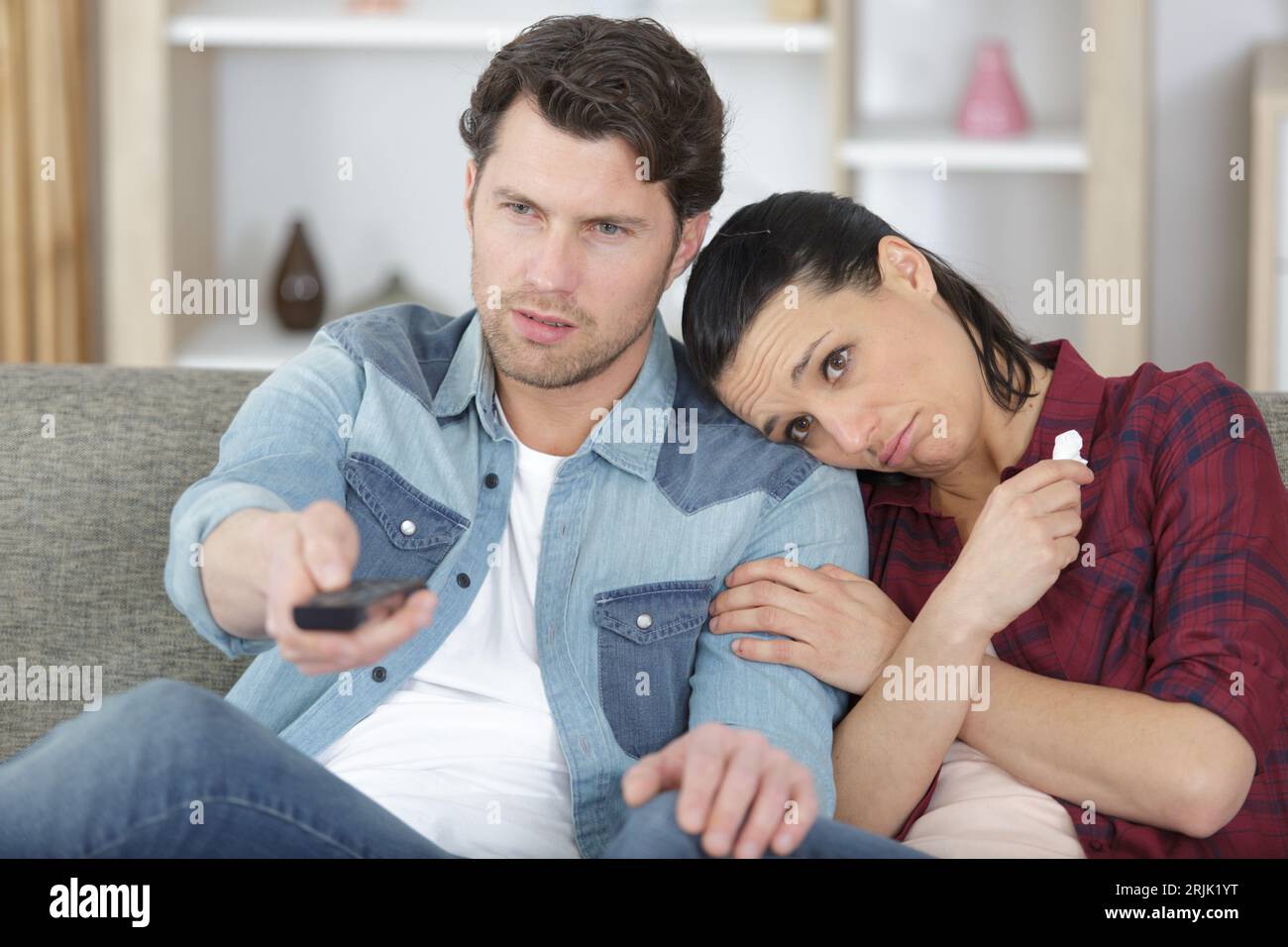 emotional couple watching a sad movie Stock Photo - Alamy