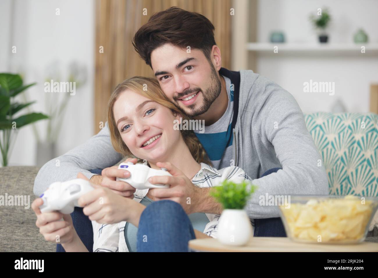 young people playing video games at home Stock Photo - Alamy
