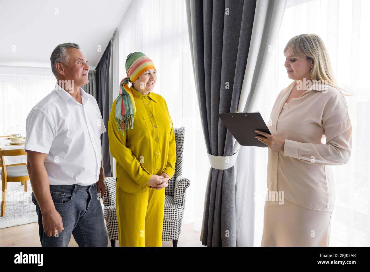 Real estate agent shows married couple summer house interior Stock ...