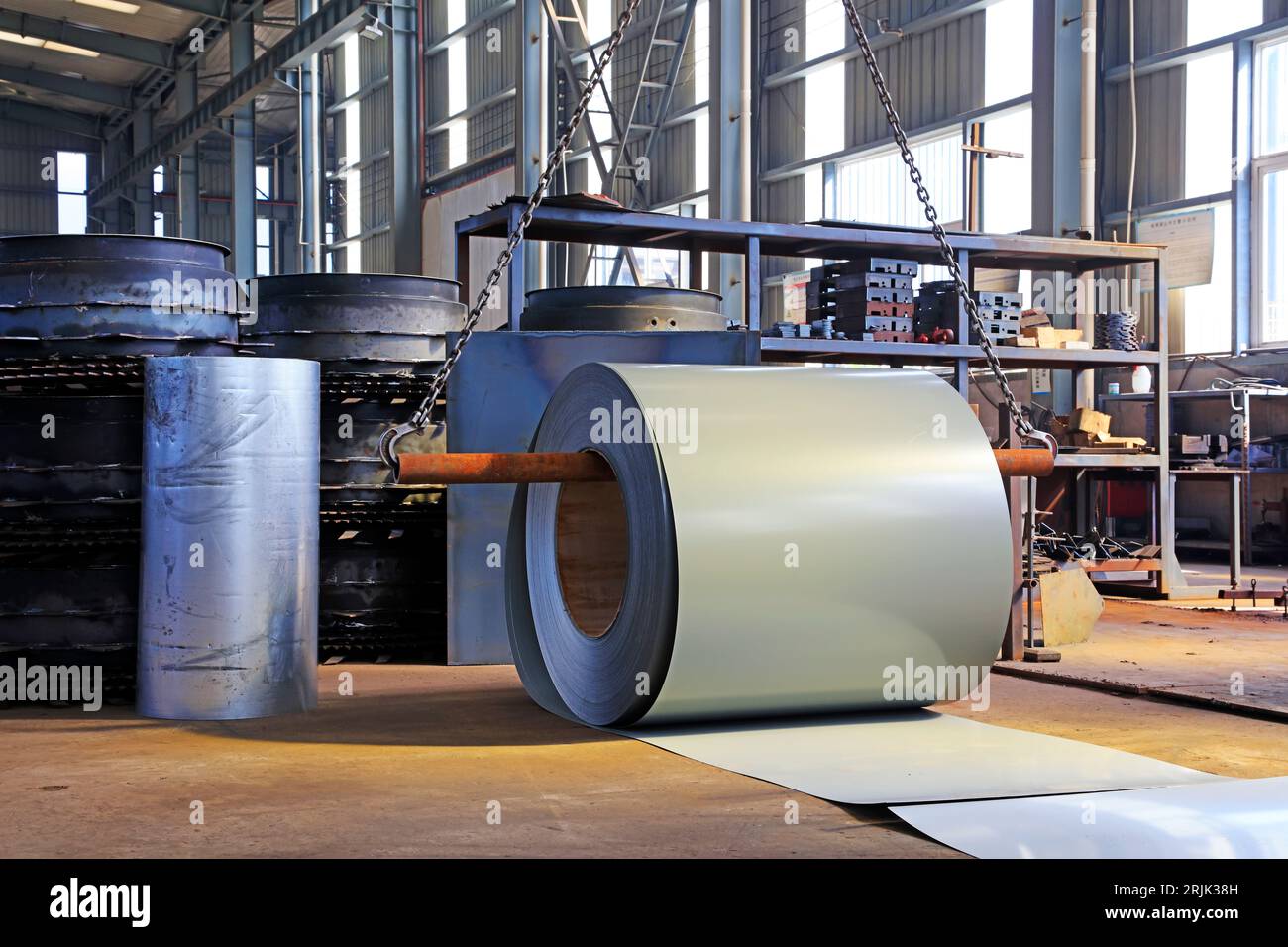 Strip steel in production workshop Stock Photo - Alamy