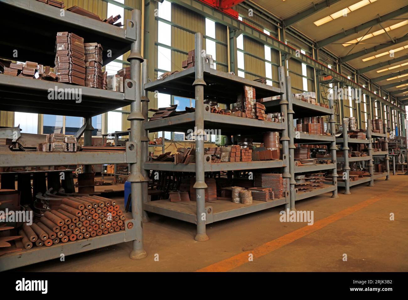 Metal parts on cargo shelves Stock Photo - Alamy