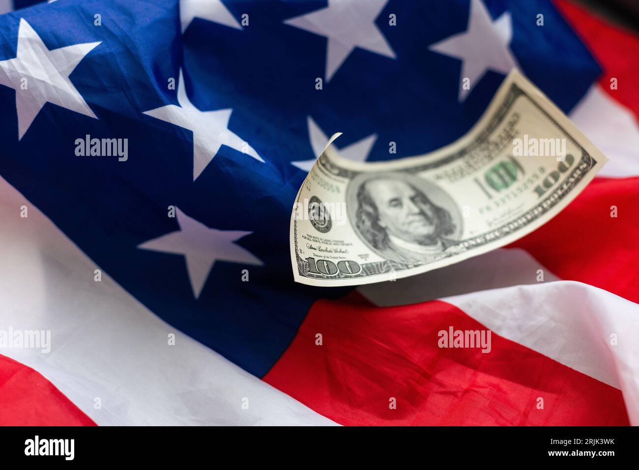 Stack of money on American Flag. dollars Stock Photo - Alamy