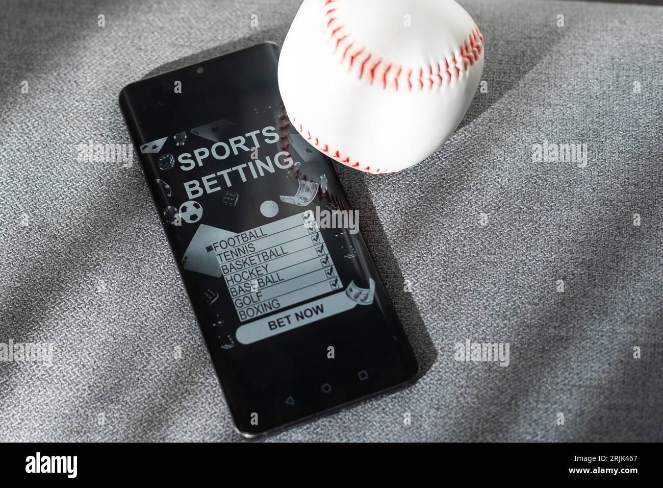 Smartphone with baseball ball and field on the screen. Sports theme and ...