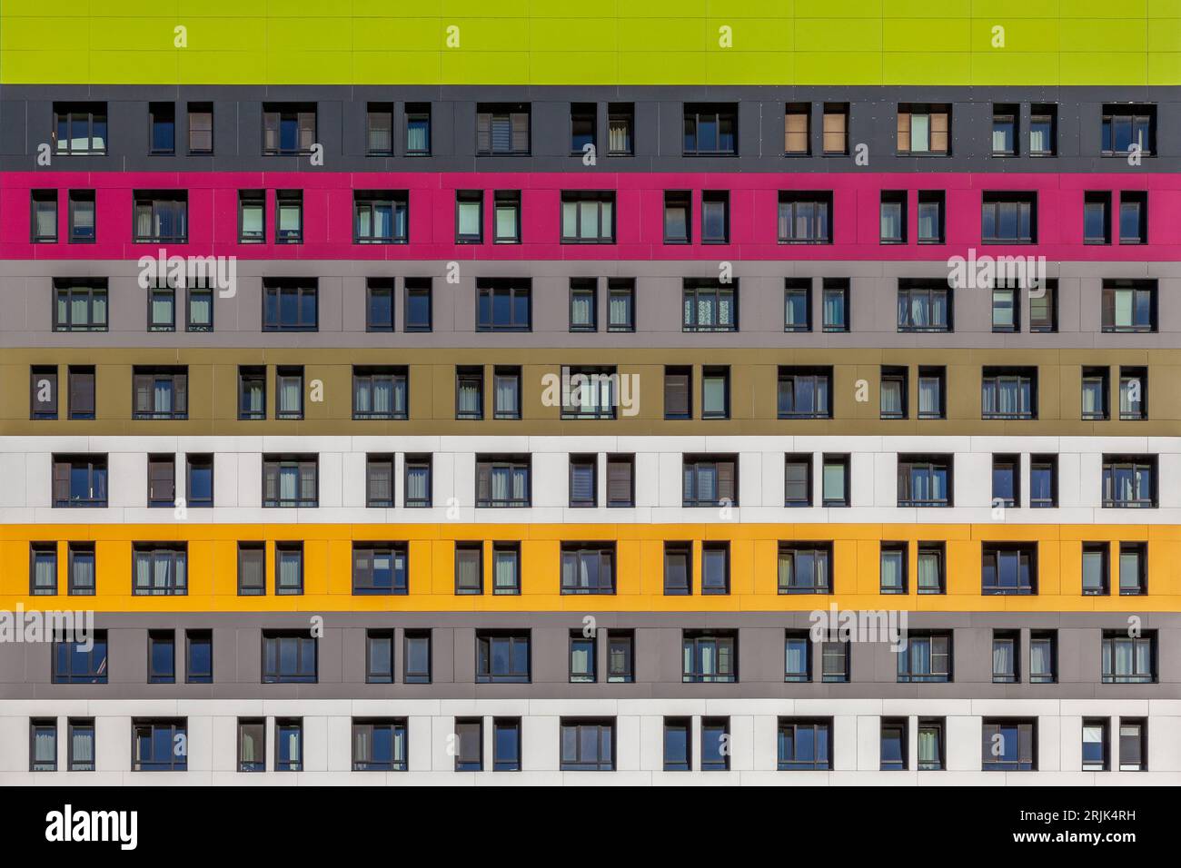 Geometric background from multi-colored rows of windows of a multi ...