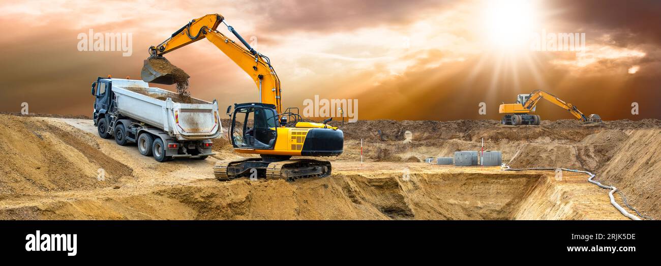 excavator is in work and digging at construction site Stock Photo - Alamy
