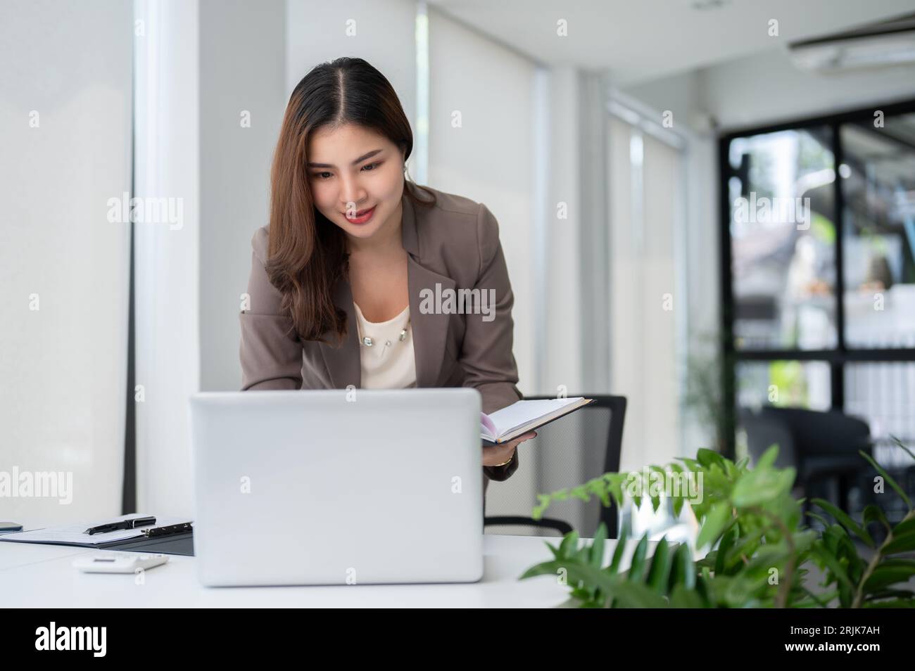 Woman bending over table hi-res stock photography and images - Alamy