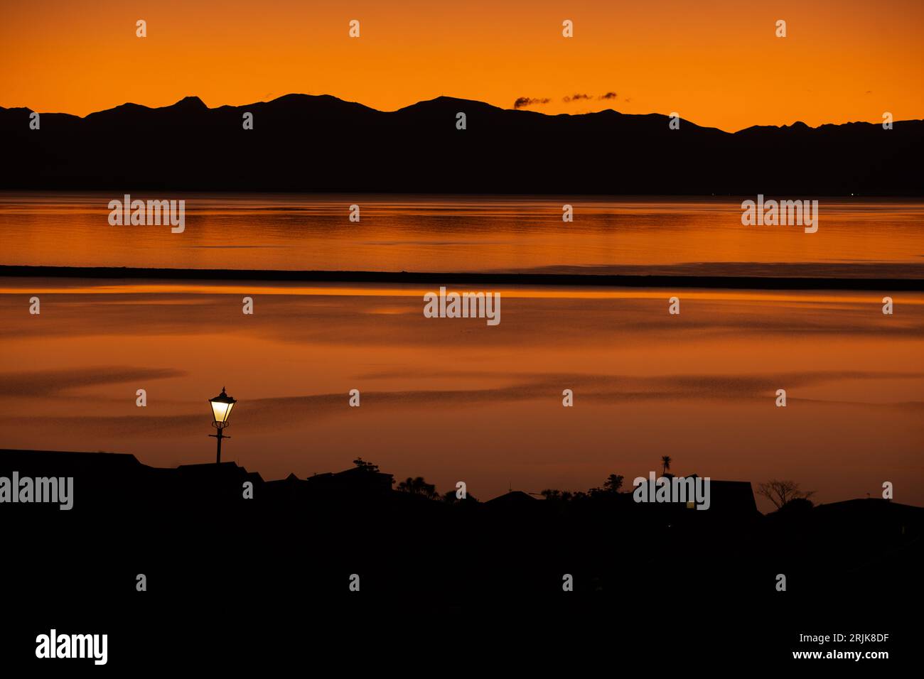 Sunset over Tasman Bay, Nelson, New Zealand Stock Photo - Alamy