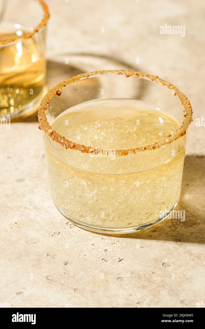 cocktail on beige background with shadows Stock Photo - Alamy