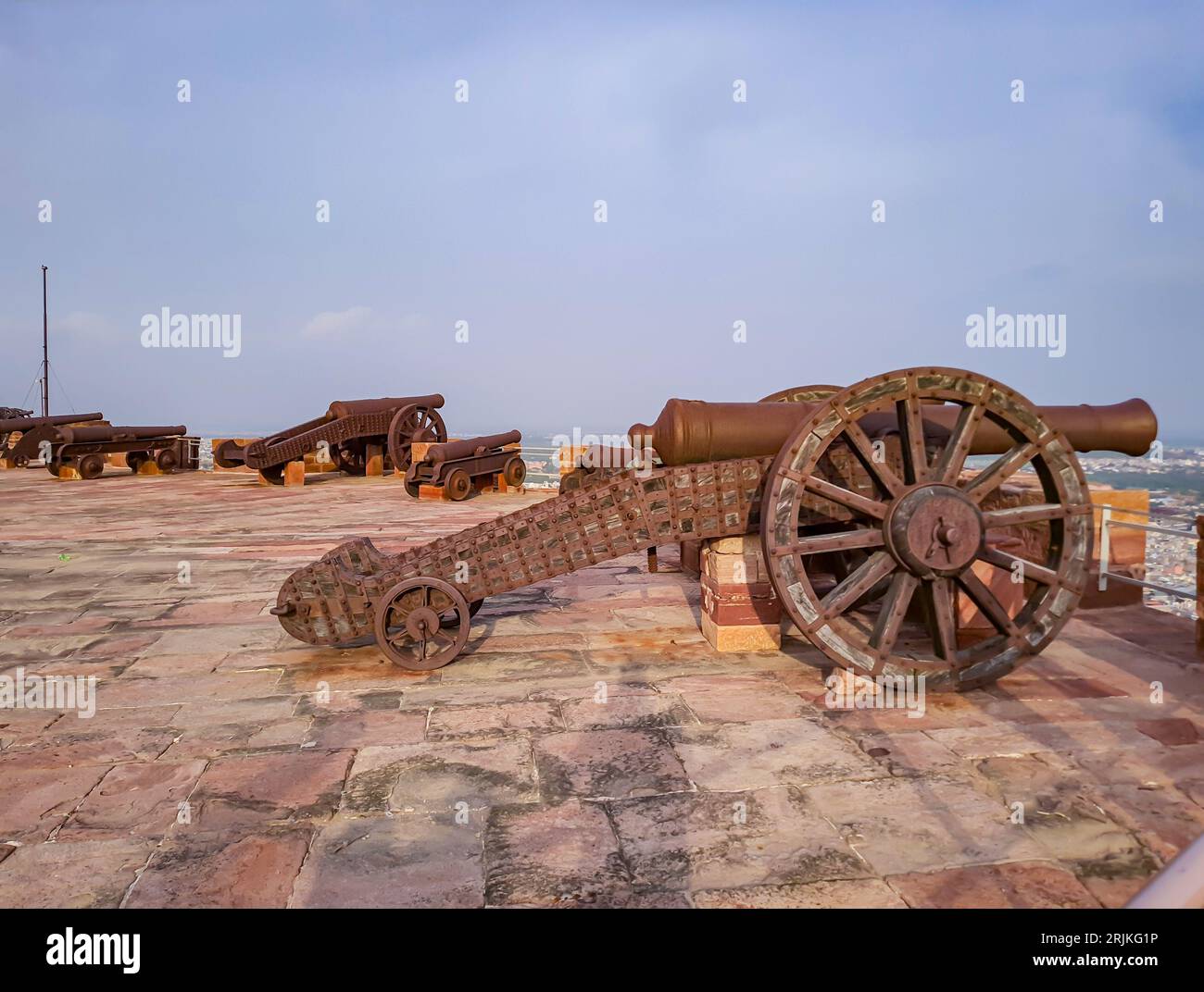 heritage iron cannon kept at ancient fort with bright blue sky at day ...