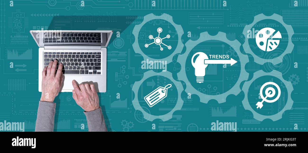 Top view of hands using laptop with symbol of trends concept Stock ...