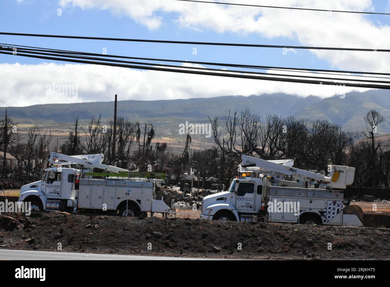 Maui, USA. 22nd Aug, 2023. Engineered trucks are seen in fire-ravaged ...