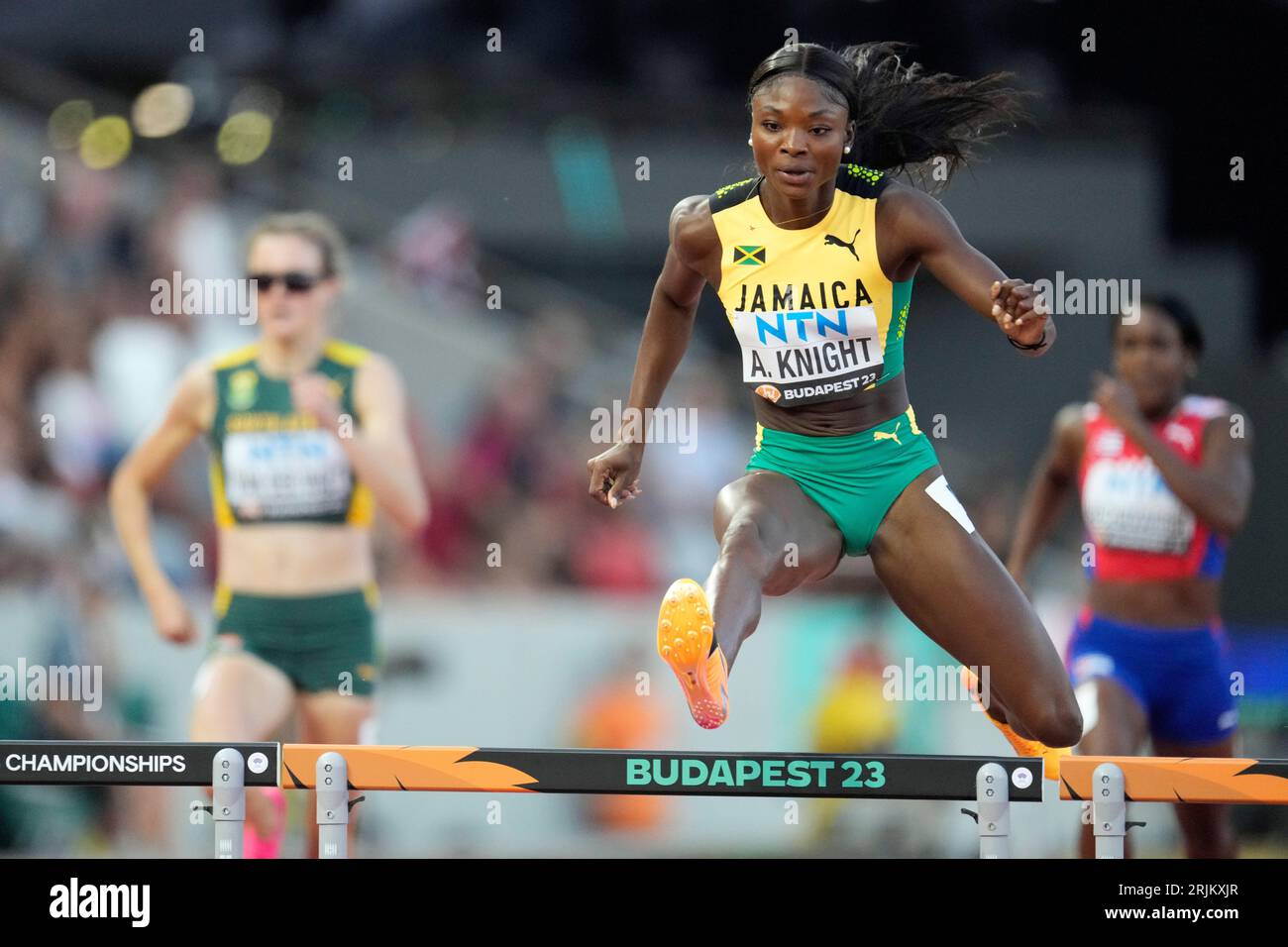 Andrenette Knight, of Jamaica, competes in a Women's 400-meter hurdles ...