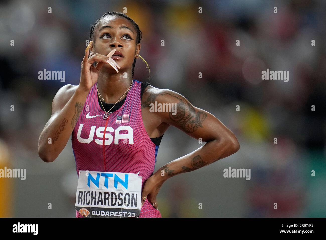 Sha'Carri Richardson, of the United States, reacts after her women's ...