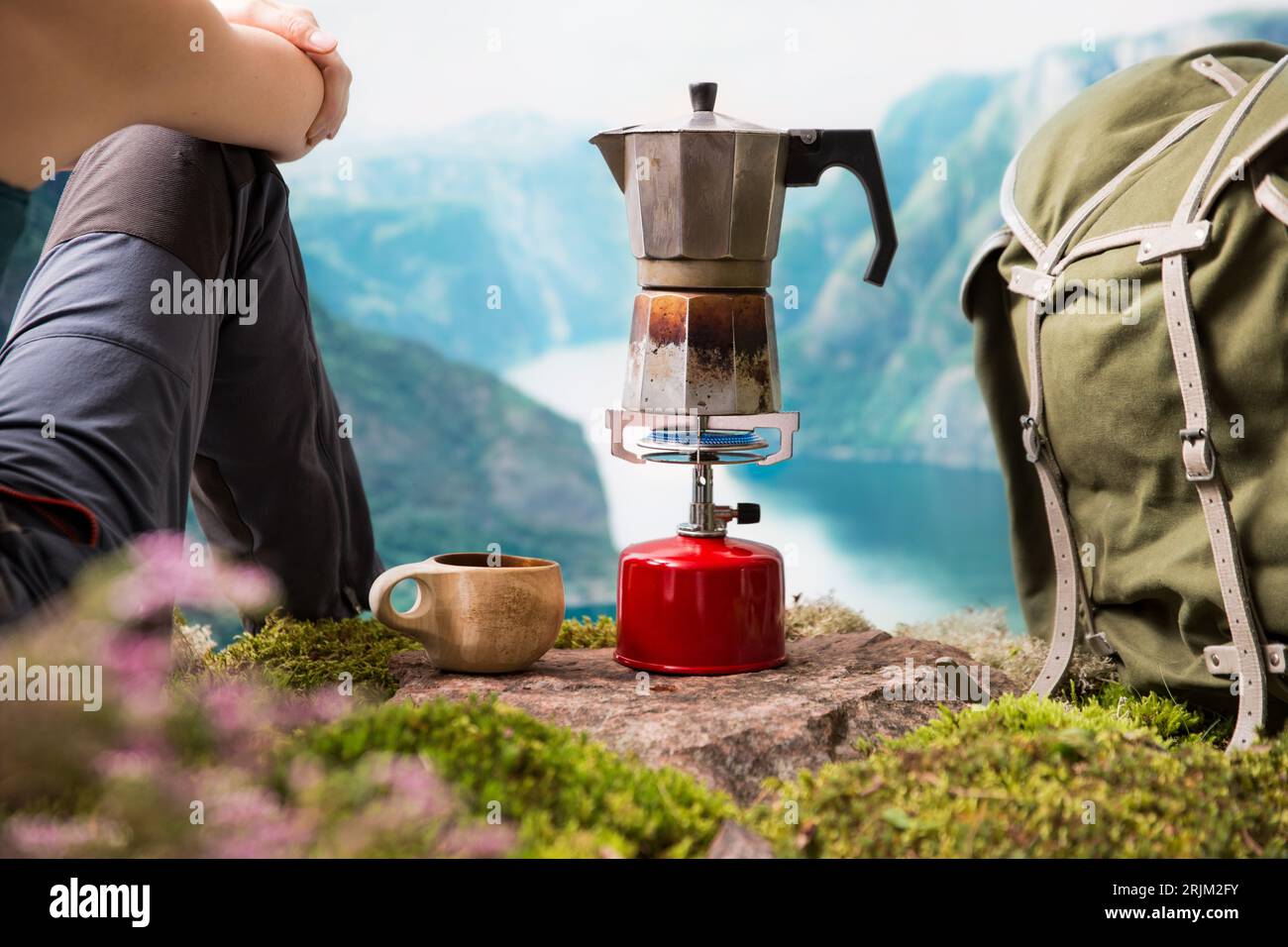 Cooking, making coffee or tea on a portable camping gas burner with a ...