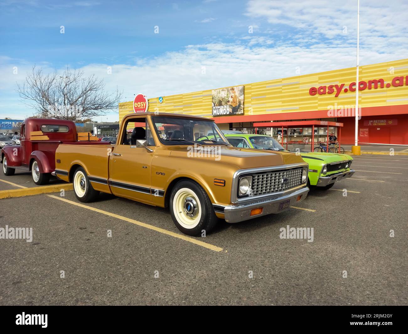 old golden 1972 Chevrolet Chevy C10 Brava pickup truck in a parking lot ...