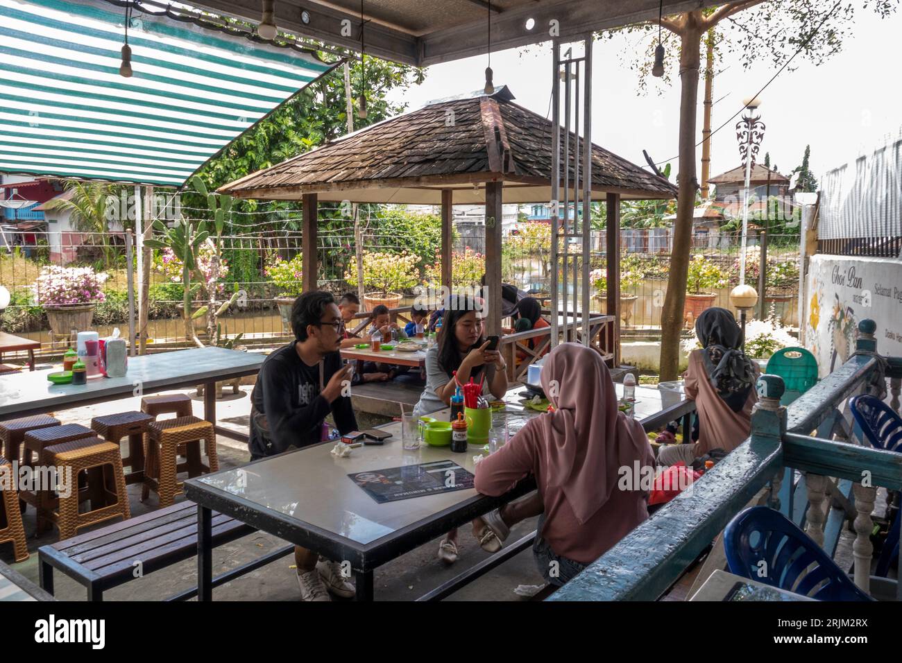 Customers at Rumah Keluarga Tjhia (Tjhia's villa), Singkawang, West ...