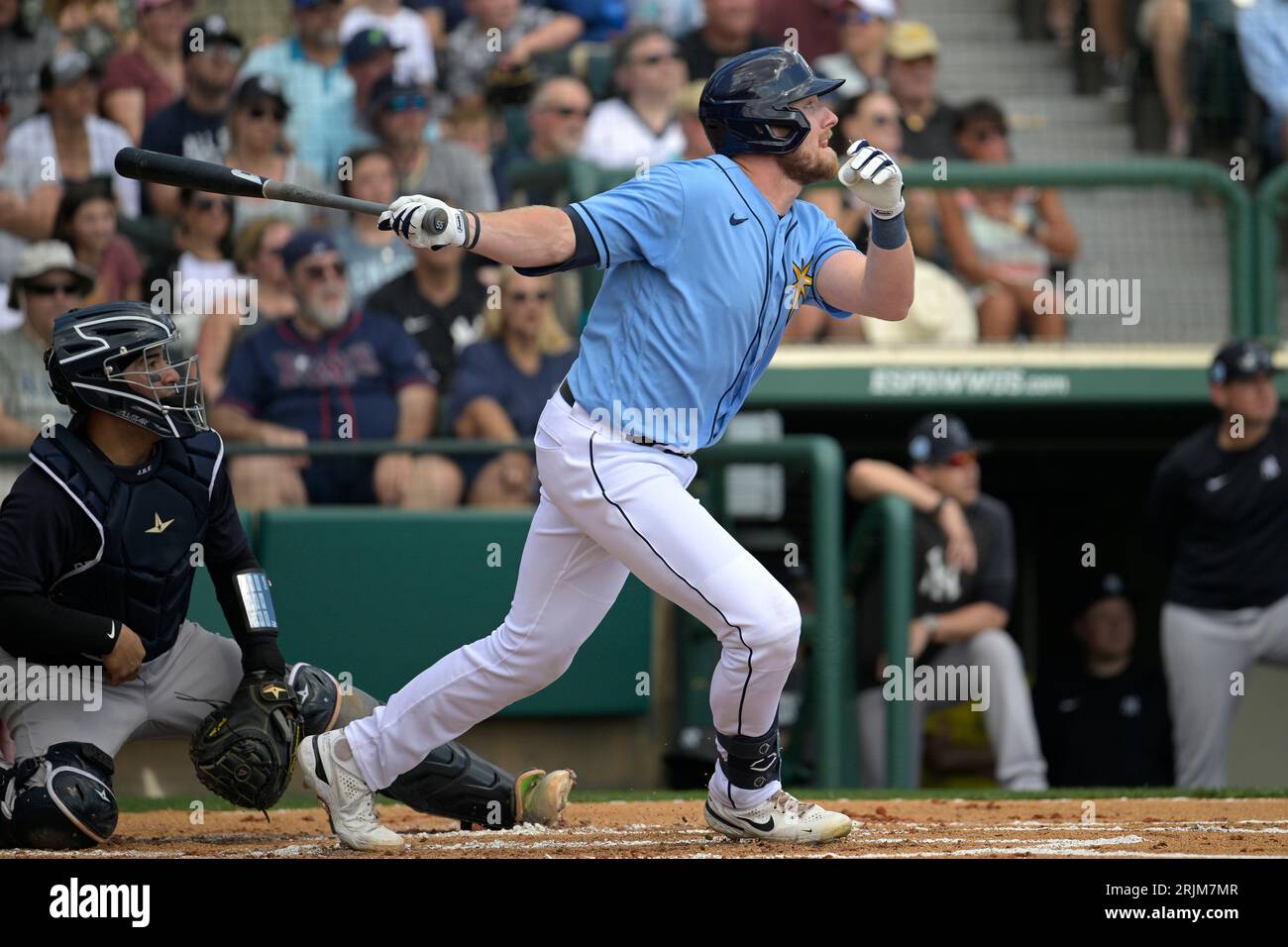 Tampa Bay Rays' Luke Raley watches the flight of the ball after hitting ...