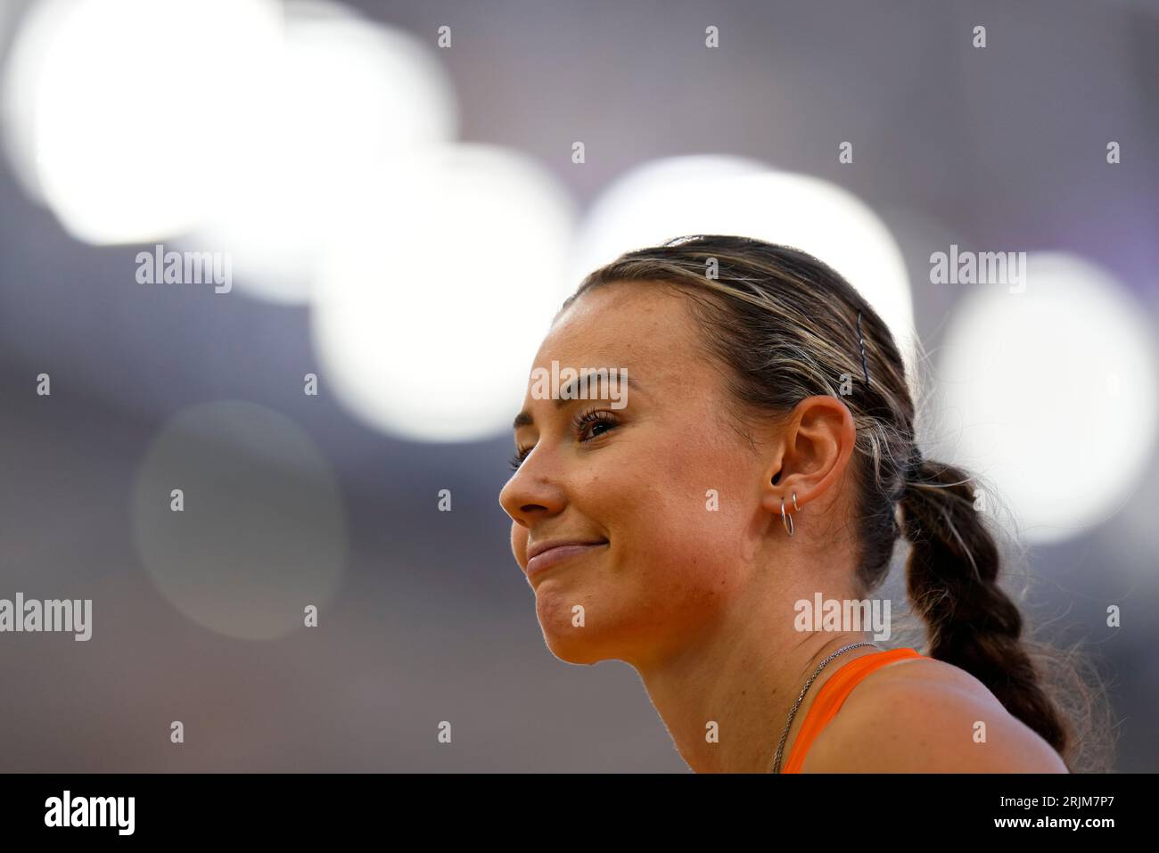 Nadine Visser, of the Netherlands smiles after finishing a Women's 100-meters hurdles heat ...