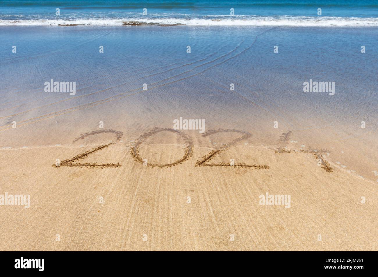 2024 written on a beach in sand hi-res stock photography and images - Alamy