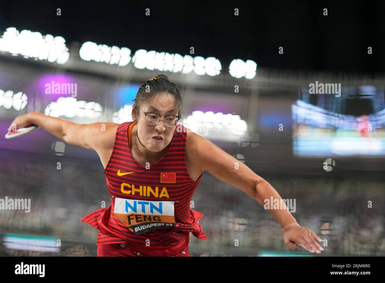 Bin Feng, of China, makes an attempt in the Women's discus throw final ...