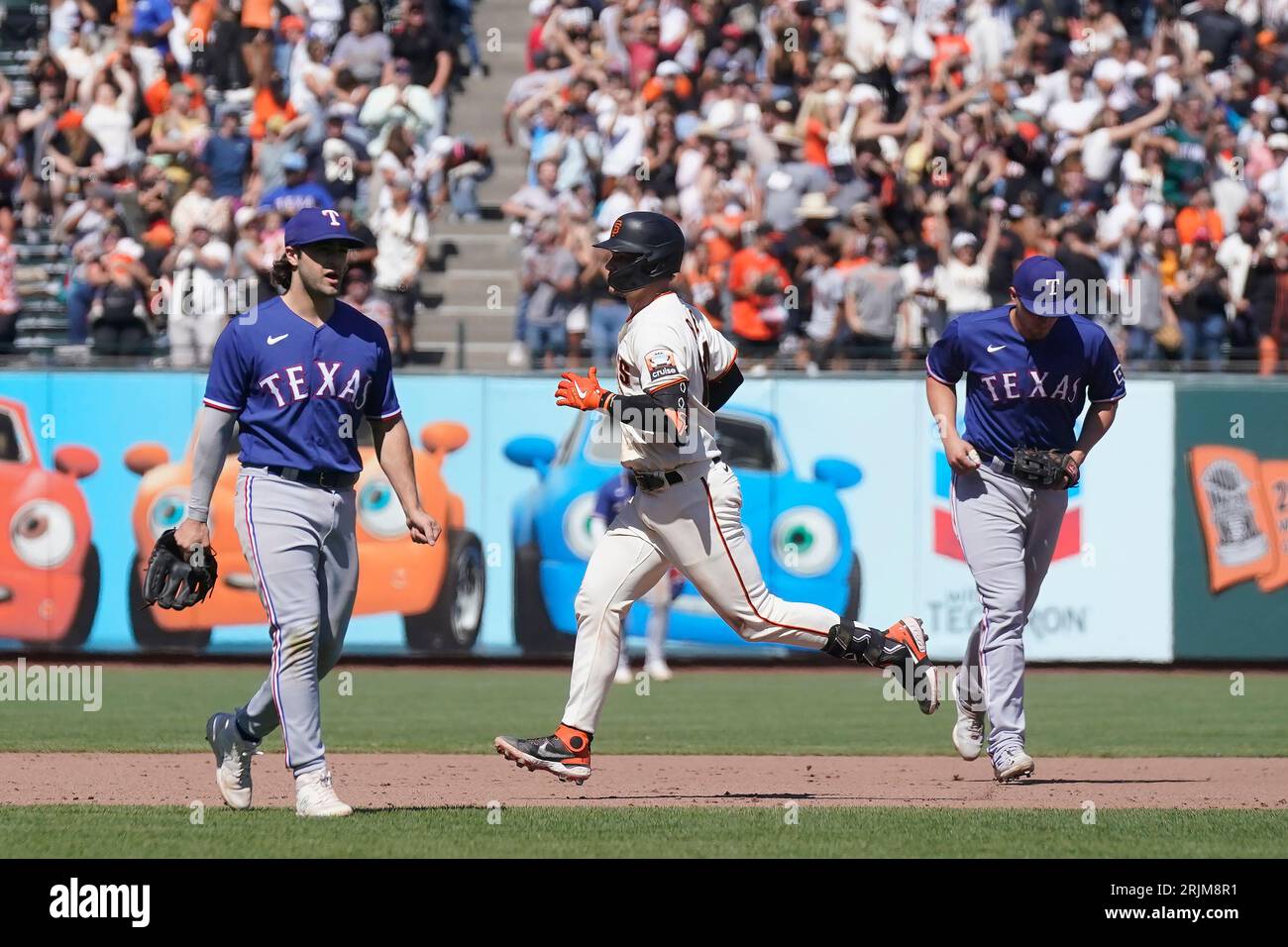 San Francisco Giants' Patrick Bailey, middle, rounds the bases after ...