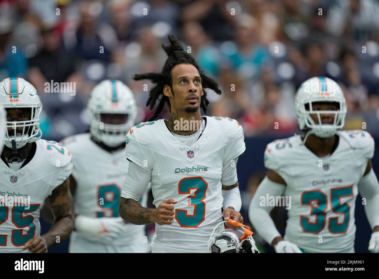 Miami Dolphins wide receiver Robbie Chosen (3) and teammates run on to ...