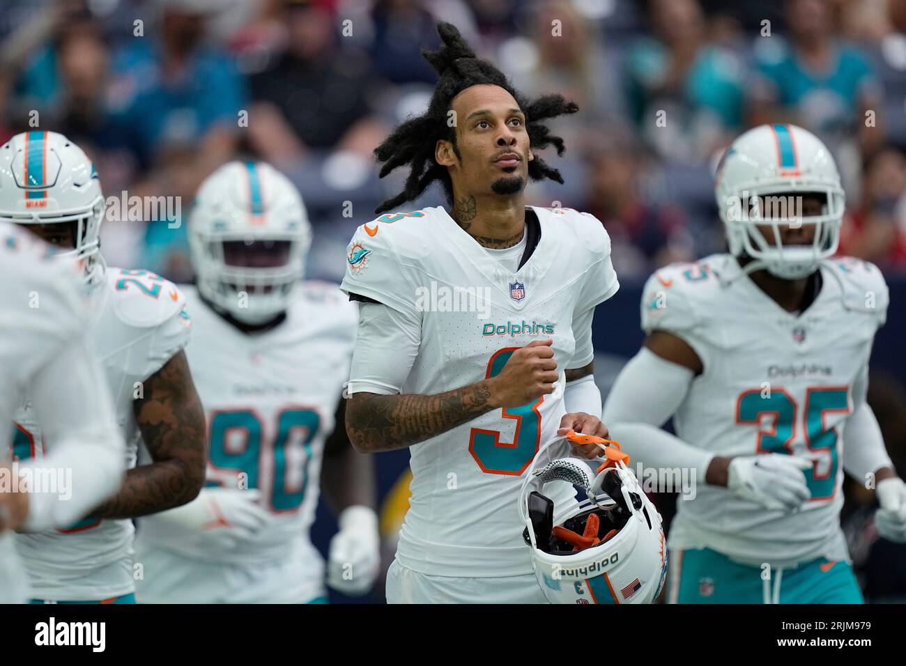 Miami Dolphins wide receiver Robbie Chosen (3) and teammates run on to ...