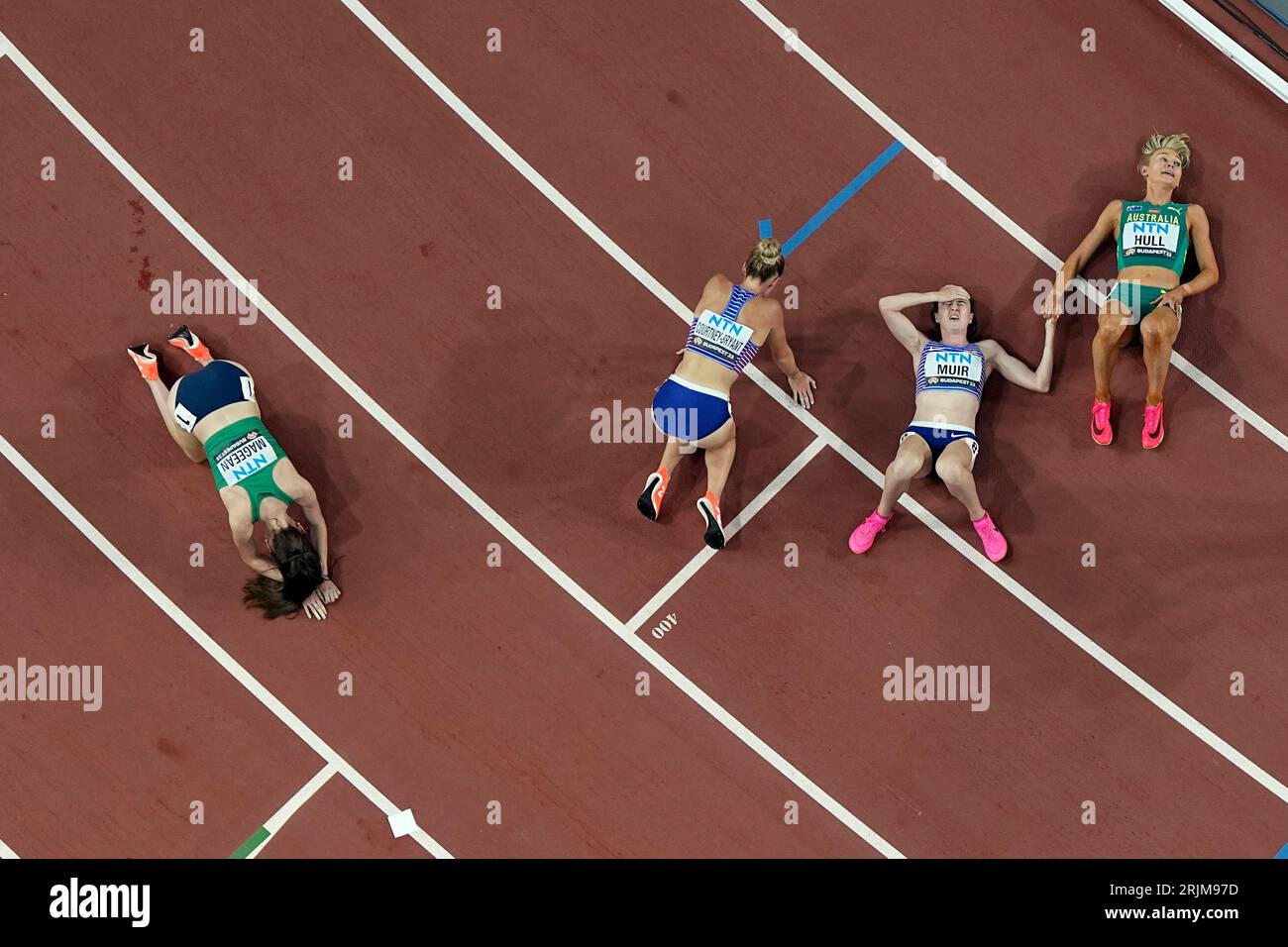Runners collapse on the track after running the Women's 1500-meters ...