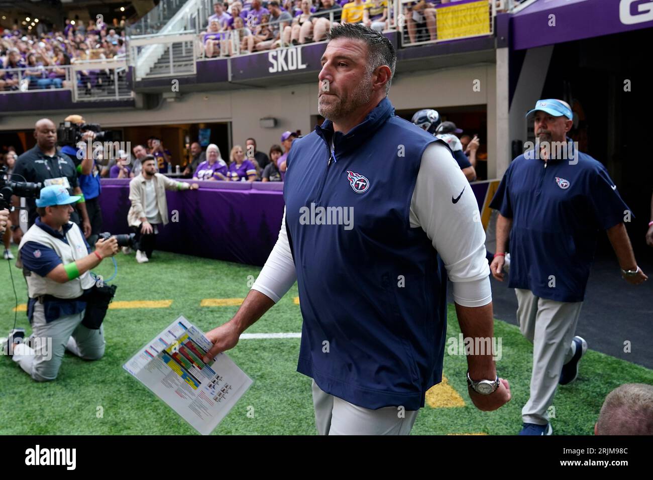 Tennessee Titans head coach Mike Vrabel walks onto the field before an ...