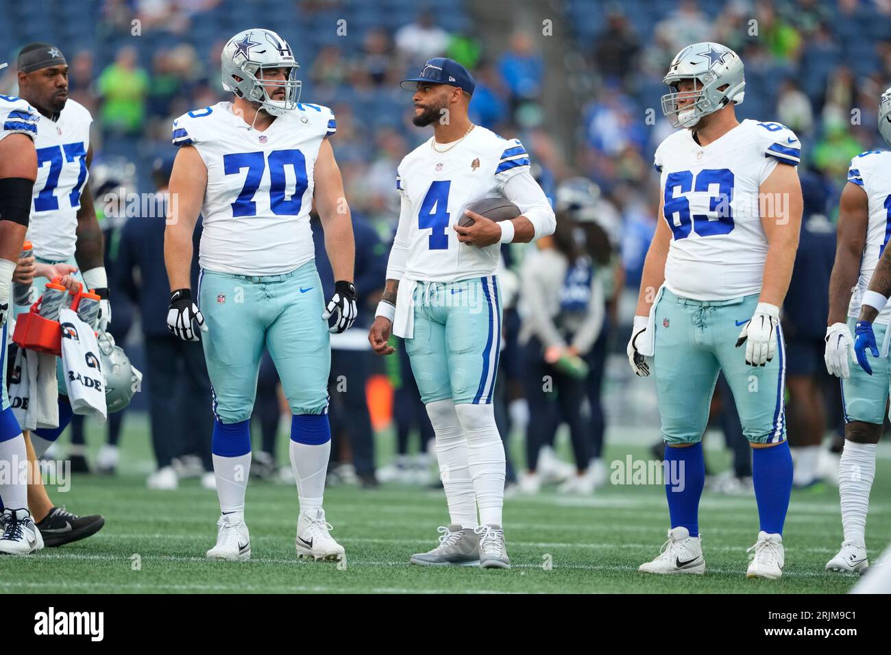 Dallas Cowboys guard Zack Martin (70) talks with quarterback Dak ...